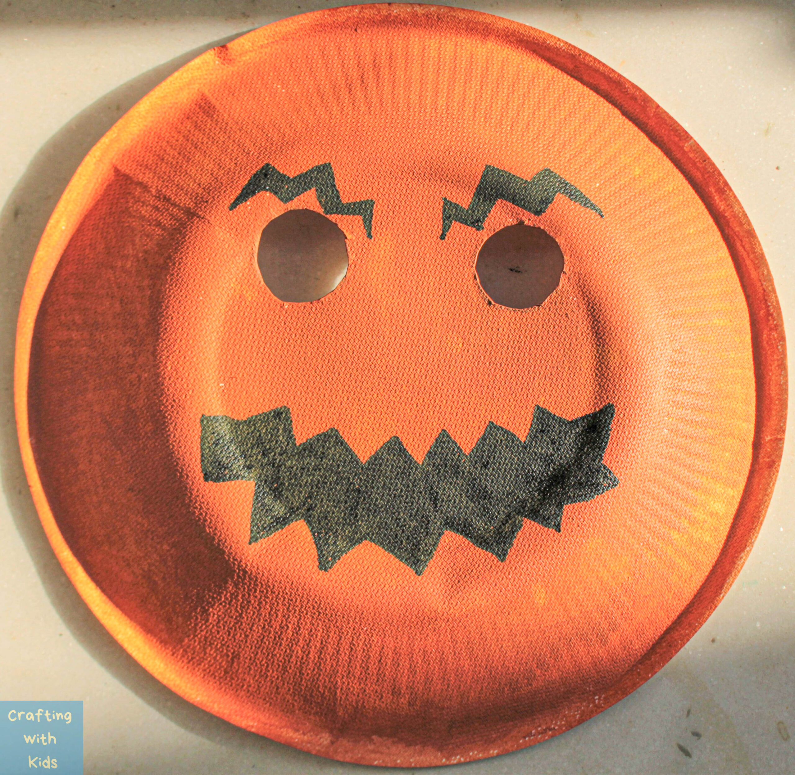 Paper Plate Pumpkin Mask for an Easy Halloween Craft