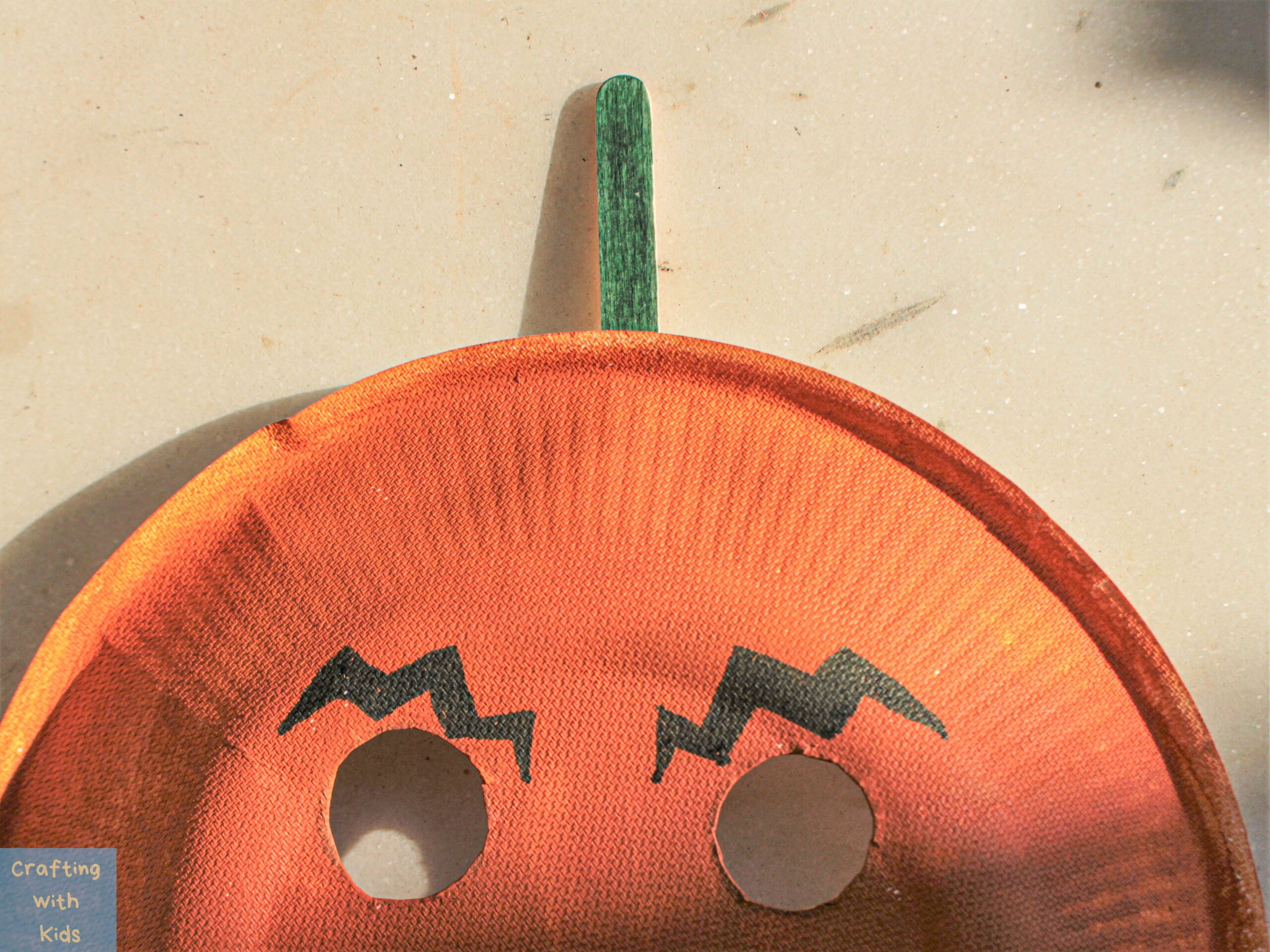 Paper Plate Pumpkin Mask for an Easy Halloween Craft